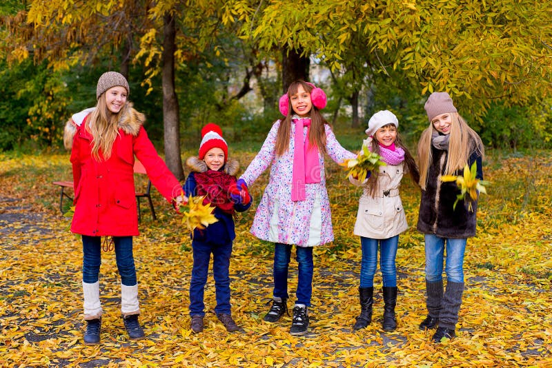 Group of Girls in Autumn Park with Leafs Stock Photo - Image of autumn ...