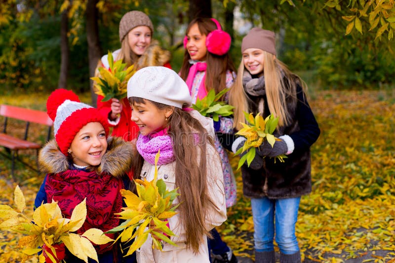 Group of Girls in Autumn Park with Leafs Stock Photo - Image of ...