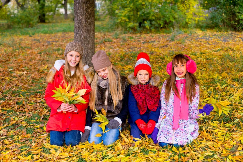 Group of Girls in Autumn Park with Leafs Stock Image - Image of autumn ...