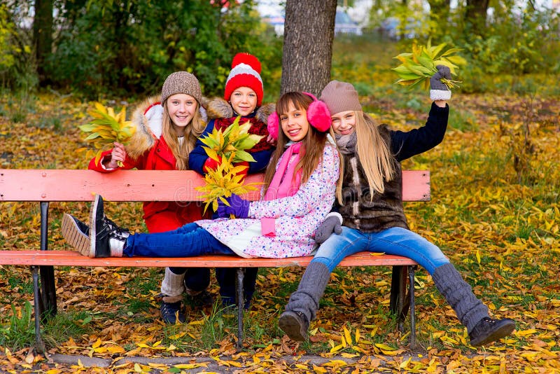 Group of Girls in Autumn Park with Leafs Stock Photo - Image of child ...