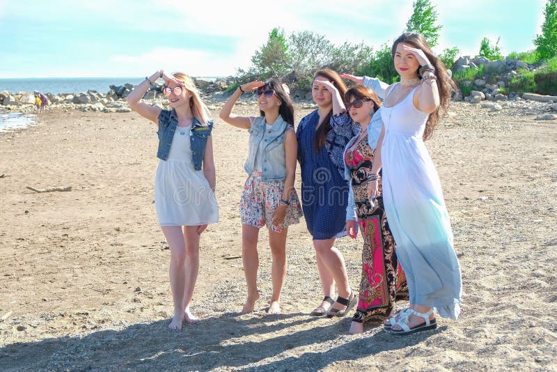 Group of Girls Looking Away at the Beach Stock Image - Image of casual ...