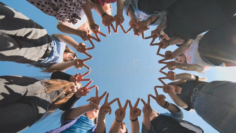A Group of Girls Makes a Circle from Their Fingers. Stock Photo - Image ...