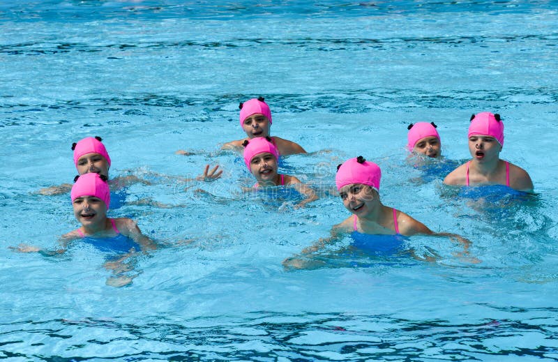 Group of Girls in a Pool Practicing Synchronized Swimming Editorial ...