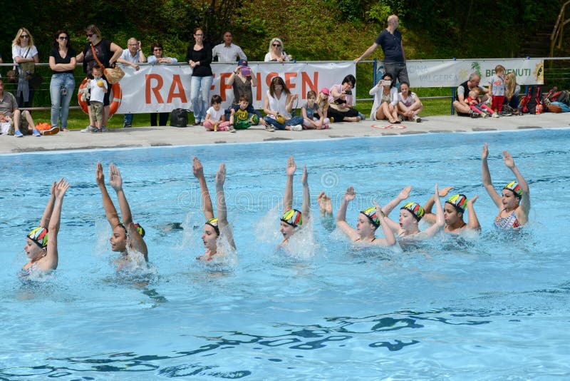Group of Girls in a Pool Practicing Synchronized Swimming Editorial ...