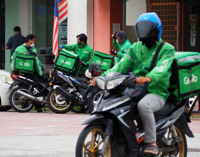 A Group of GrabFood Riders editorial stock photo. Image of flag - 235820578