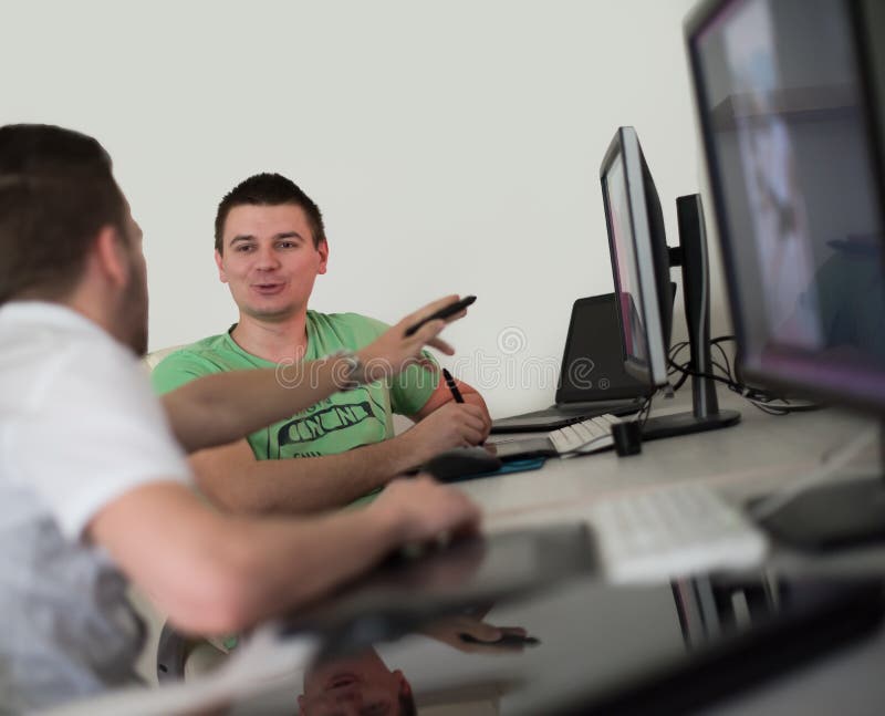 A Group of Graphic Designers at Work Stock Image - Image of media ...