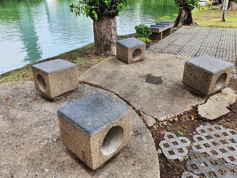A Group of Grid Stone Benches on Cement Brick Ground Floor at the City ...