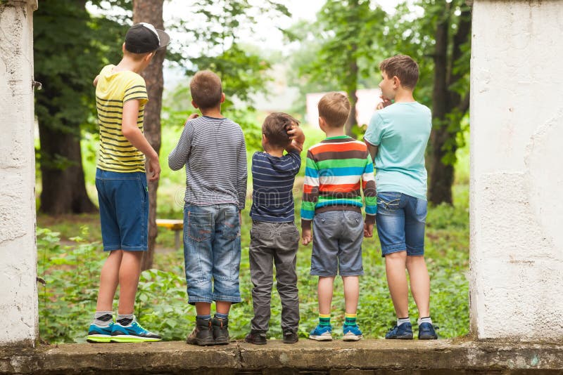 Group of Guys in a Row Back View Stock Image - Image of green, natural ...