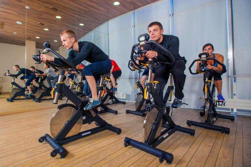 Group of Gym People on Machines, Cycling in Class Stock Image - Image ...