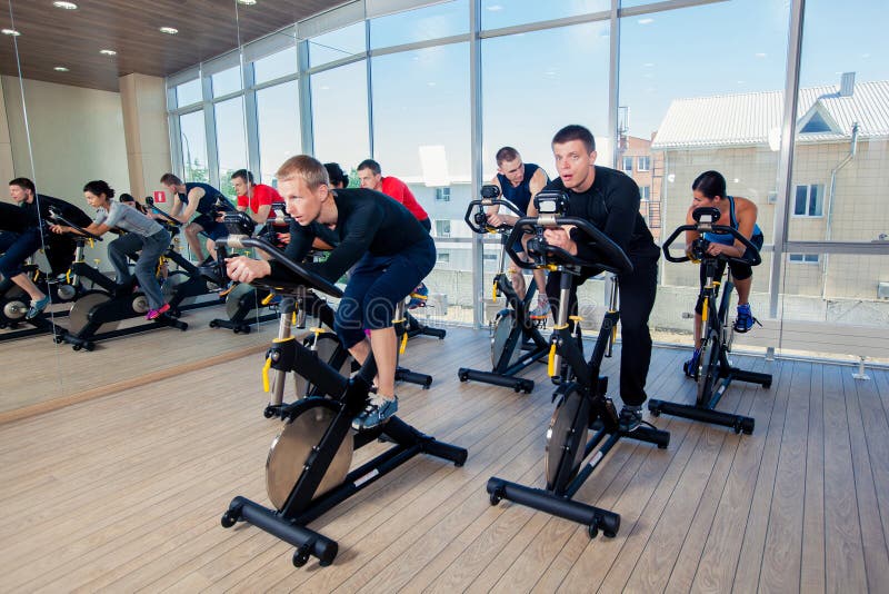Group of Gym People on Machines, Cycling in Class Stock Image - Image ...