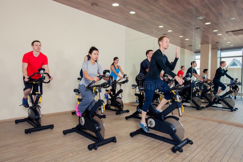 Group of Gym People on Machines, Cycling in Class Stock Photo - Image ...