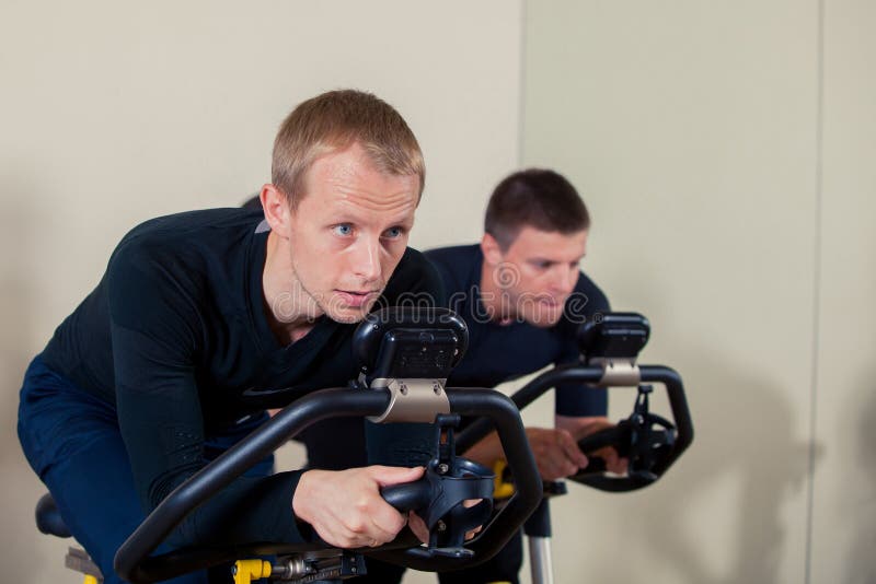 Group of Gym People on Machines, Cycling in Class Stock Photo - Image ...