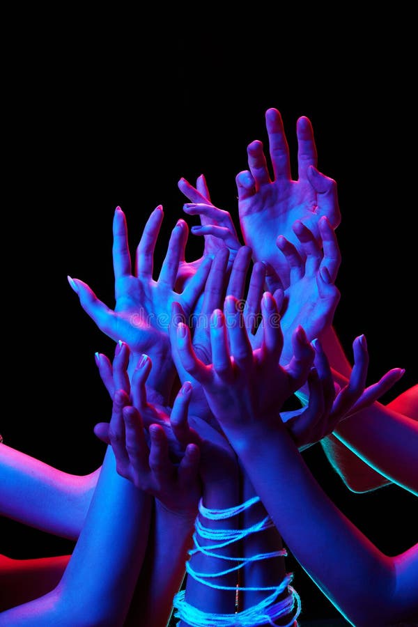 Group of Hands Reaching Upwards in Various Gestures Tied with Strings ...