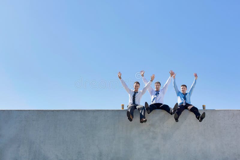 Group of Handsome Businessmen Sitting while Having Fun in Office ...