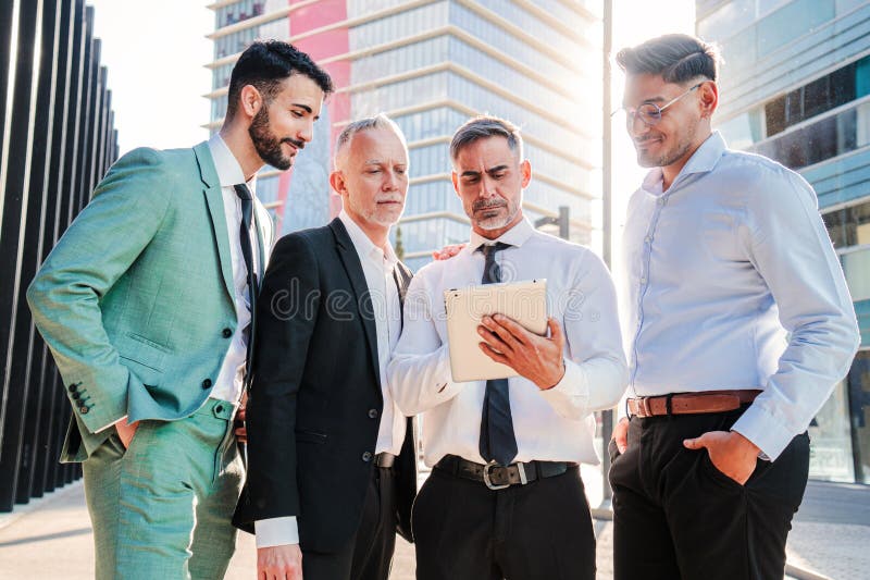 Group of Handsome Startup Businessmen Team Work with Suit Using a ...