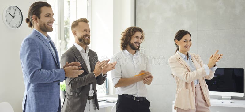 Group of Happy Business People Standing in Office, Smiling and ... Group of Happy Business People Standing in Office, Smiling and ...