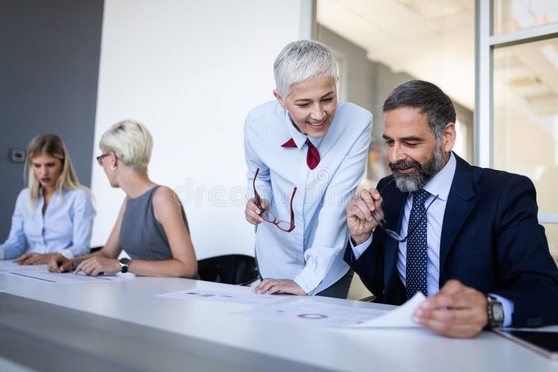 Group of Happy Business People Working in a Meeting at Office Stock ... Group of Happy Business People Working in a Meeting at Office Stock ...