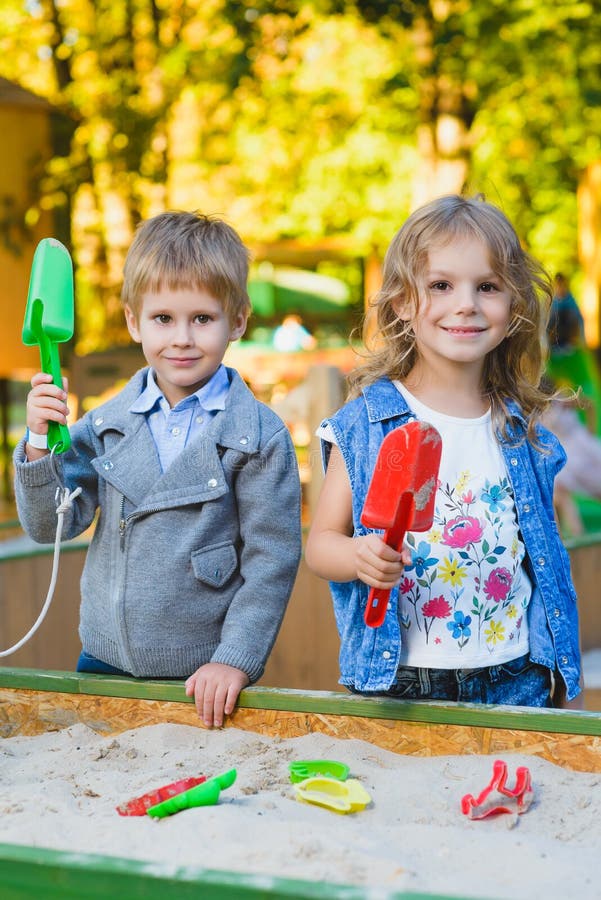 Group of Happy Children Playing in Sandbox at Playground Stock Photo ...