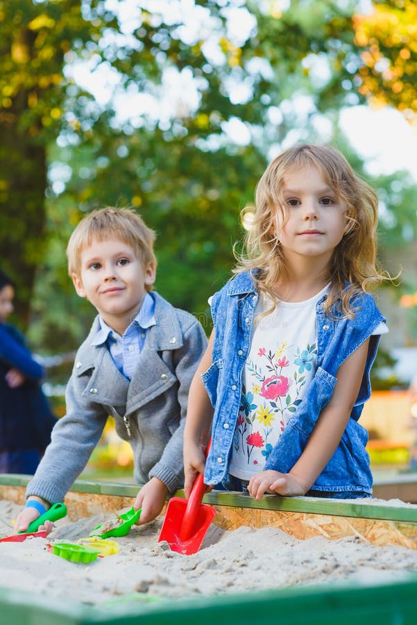 Group of Happy Children Playing in Sandbox at Playground Stock Photo ...