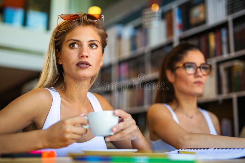 Group of Happy Young Female Studying Together in College Library. Study ...