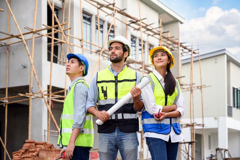 Group of Happy Contractors, Engineers and Formats in Safety Vests with ...