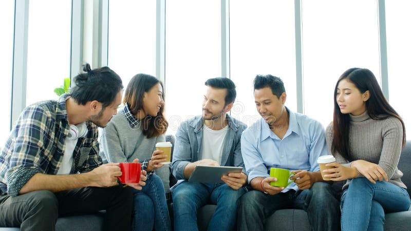 Group of Happy Creative Team Discussinng while Taking Coffee Break at ...