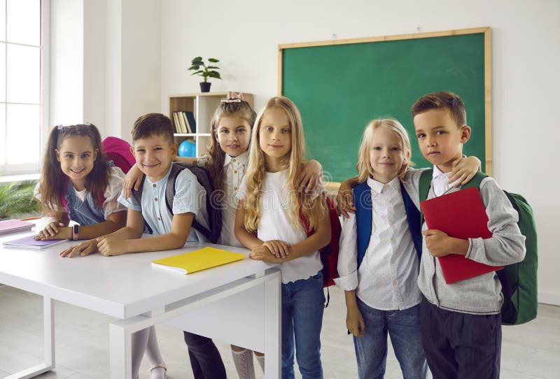 Group of Happy Elementary Students in the Modern Classroom on the First ...