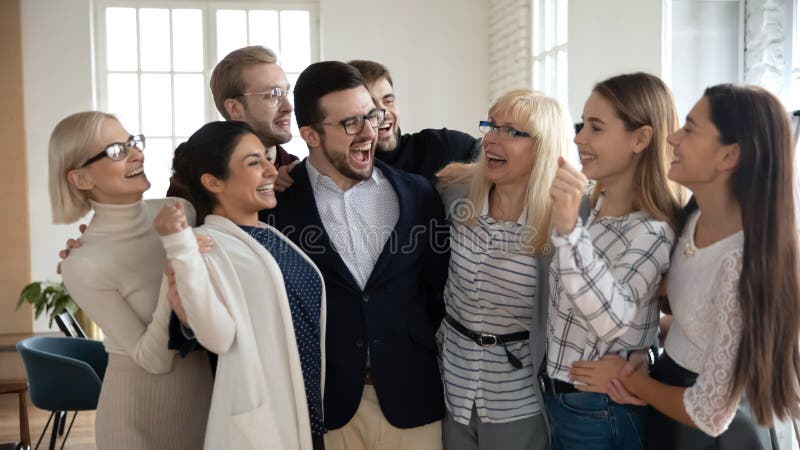Group of Happy Employees of Different Generations Hugging Together ...