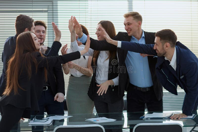Group of Happy Employees Giving Each Other a High Five. Stock Image ...