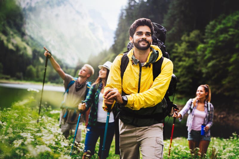 Group of Happy Friends with Backpacks Hiking Together Stock Image ...