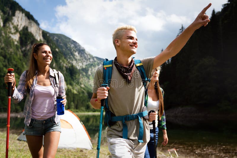 Group of Happy Friends with Backpacks Hiking Together Stock Image ...