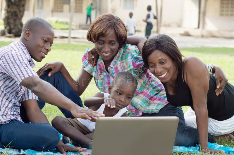 Group of Happy Friends in Front of a Laptop. Stock Photo - Image of ...