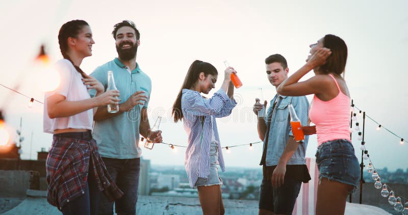 Group of Happy Friends Having Party on Rooftop Stock Image - Image of ...