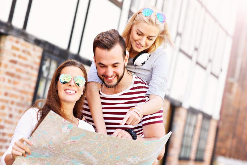 Group of Happy Friends Sightseeing with Map Stock Photo - Image of ...