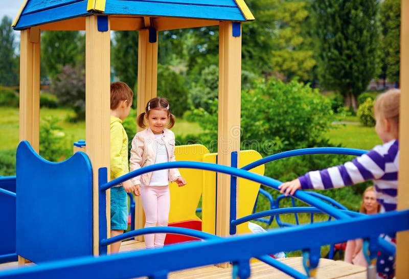 Happy Kids Having Fun on Playground in Kindergarten Stock Photo - Image ...