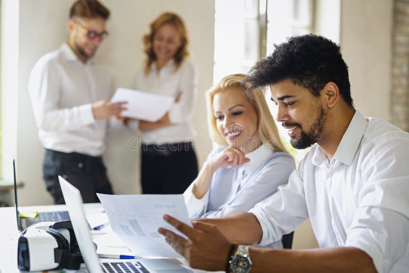 Group of Happy Multiethnic Business People Cooperating, Working on ... Group of Happy Multiethnic Business People Cooperating, Working on ...