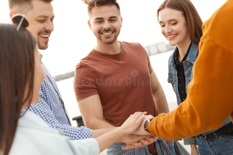 Group of Happy People Holding Hands Together Stock Photo - Image of ...