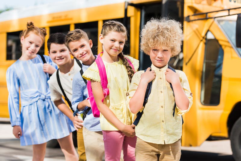 Group of Happy Pupils Looking at Camera while Standing in Row in Front ...