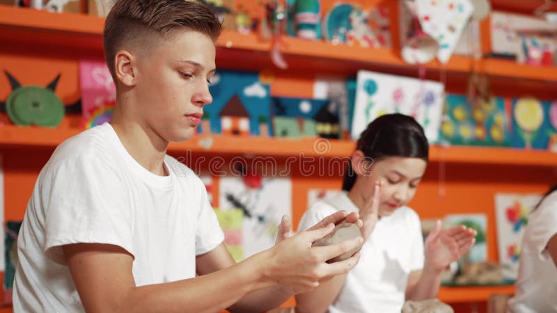 Group of Happy Smart Diverse Student Working with Clay at Workshop ...