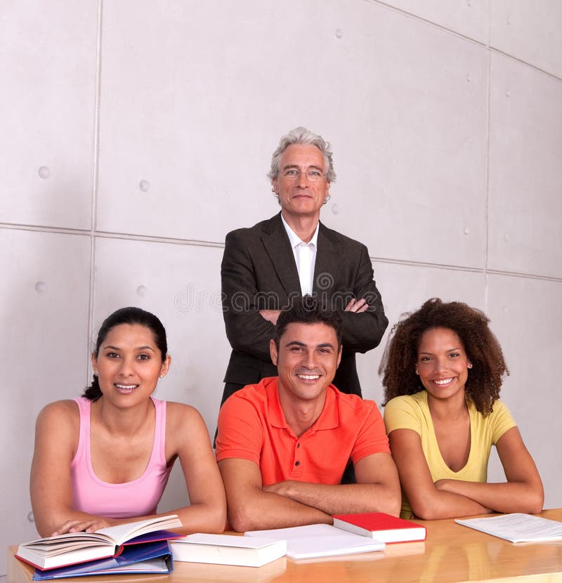 Group of happy students stock image. Image of desks, holding - 9390765