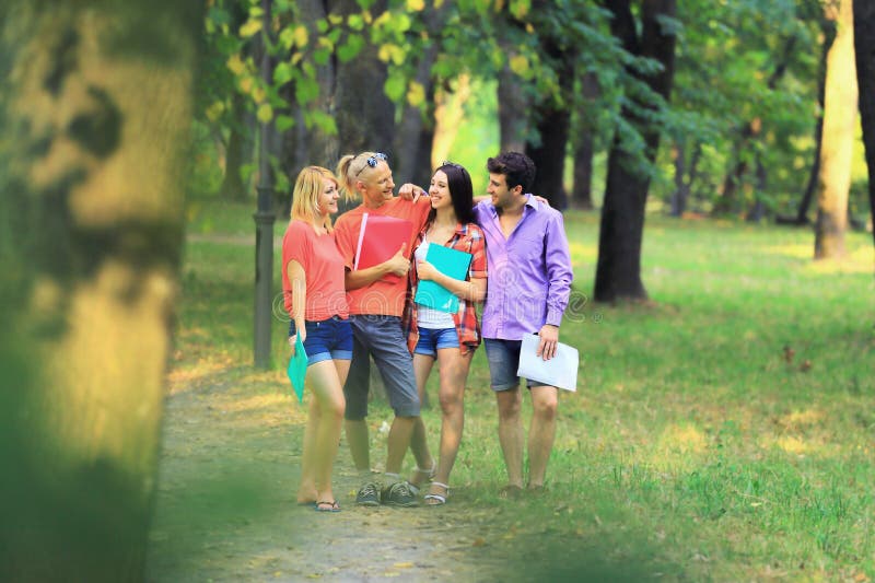 Group of Happy Students with Books in the Park Stock Photo - Image of ...