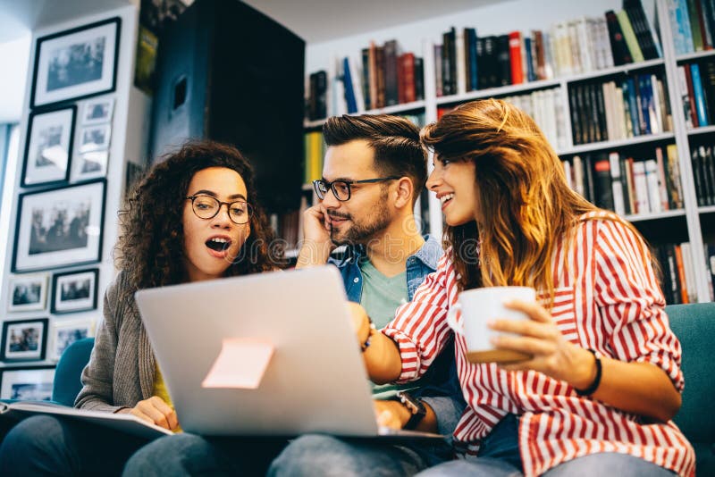 Group of Happy Students Reading Books and Preparing To Exam in Library ...