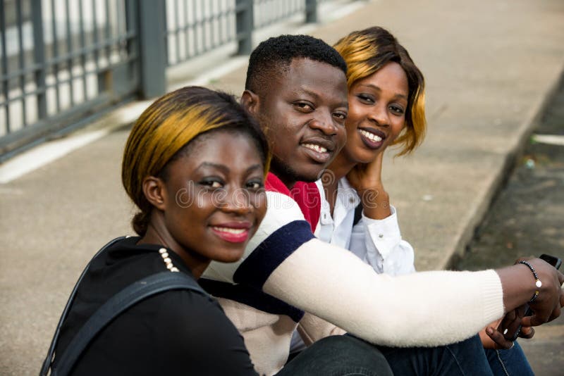Group of Happy Students Sitting Side by Side Stock Image - Image of ...