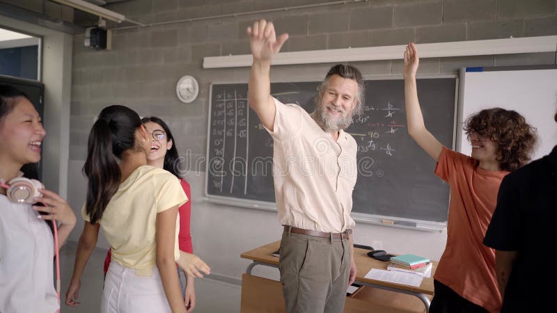 Group of Happy Students Staking Hand with the Teacher. the Professor ...