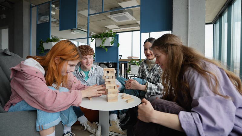 Group of Happy Teenagers Friends Playing a Board Game Made of Wooden ...