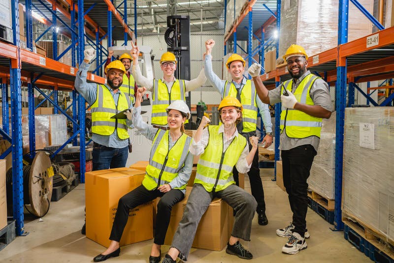 Group of Happy Warehouse Workers Celebrating Success in Warehouse Stock ...