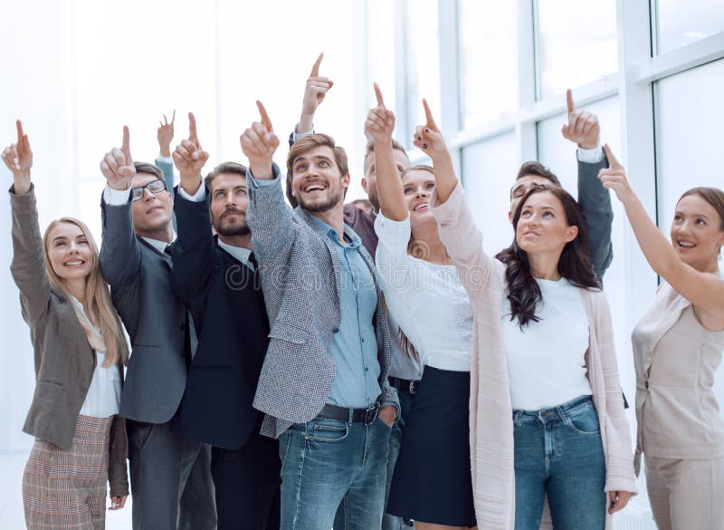 Group of Happy Young Business People Pointing Upwards Stock Photo ...