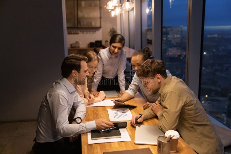 Group of Happy Young Mixed Race Employees Using Different Gadgets ... Group of Happy Young Mixed Race Employees Using Different Gadgets ...