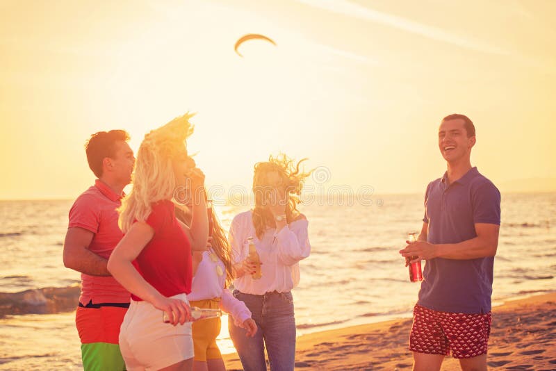Group of Happy Young People Dancing at the Beach on Beautiful Summer ...