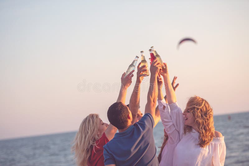 Group of Happy Young People Dancing at the Beach on Beautiful Summer ...